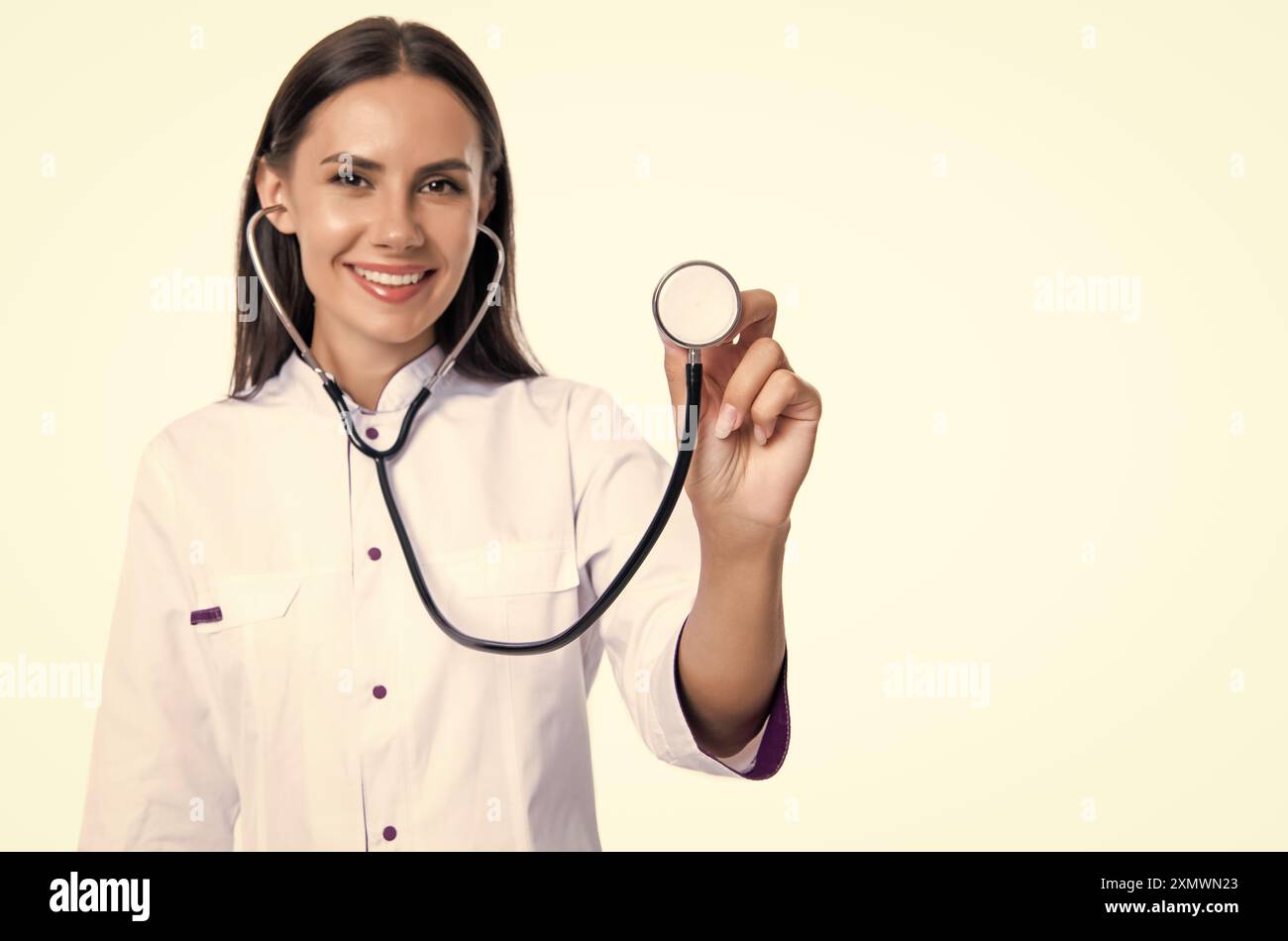 selective focus of happy cardiologist with heartbeat in stethoscope at ...