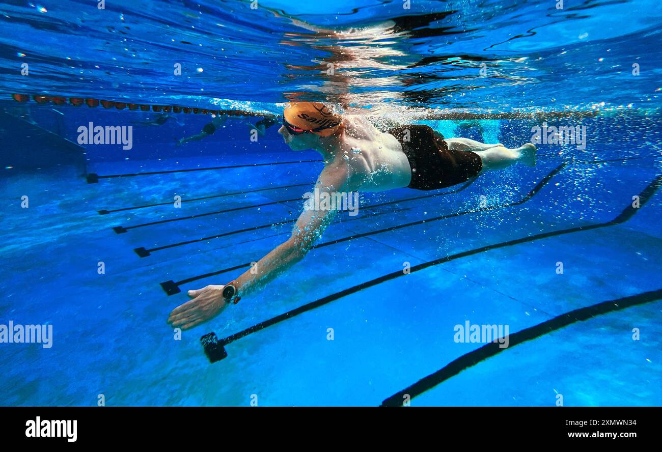 Hanover, Germany. 30th July, 2024. An early morning swimmer swims in ...