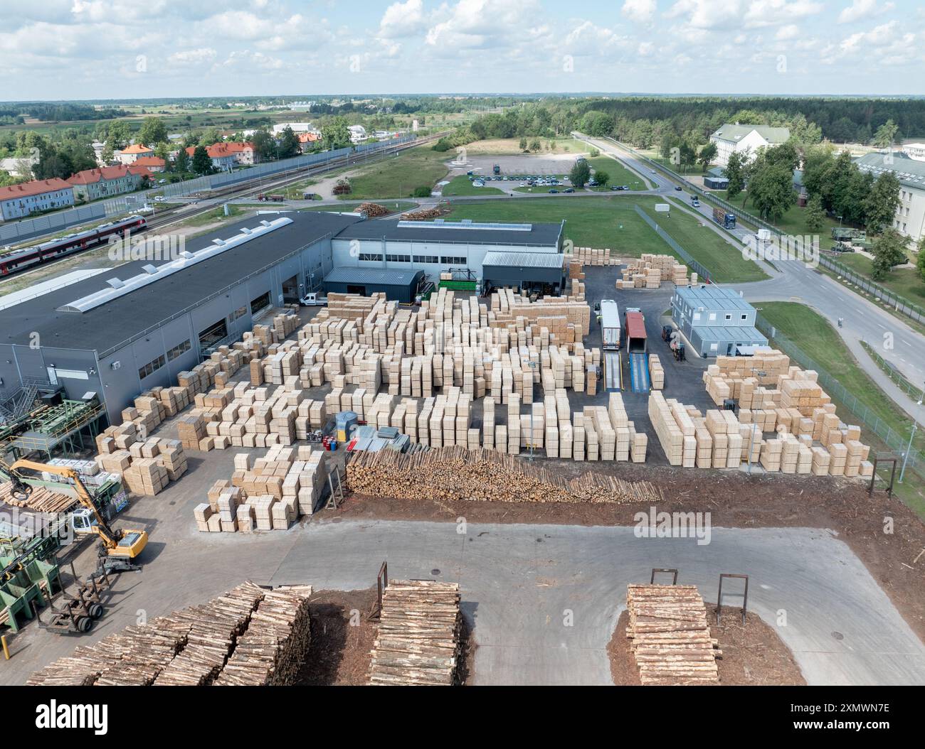 Wood sawmill, machinery for processing wood. Processing plant. A worker ...
