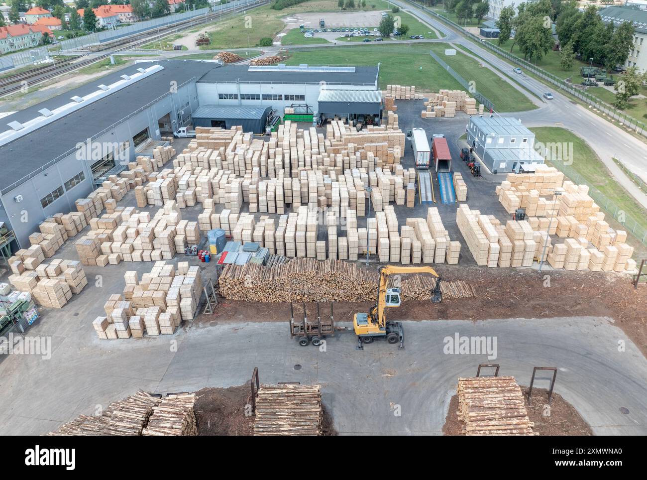 Wood sawmill, machinery for processing wood. Processing plant. A worker ...