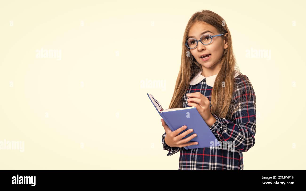 amazed school girl in noting notes isolated on white background. school ...