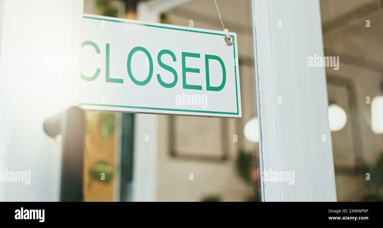 Closed sign on window, small business and cafe with startup, poster and ...