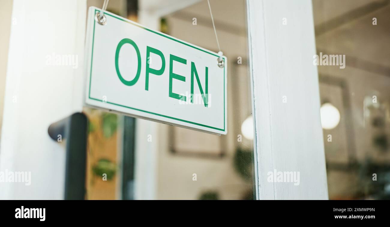 Open, sign and cafe with glass door for welcome, small business or ...