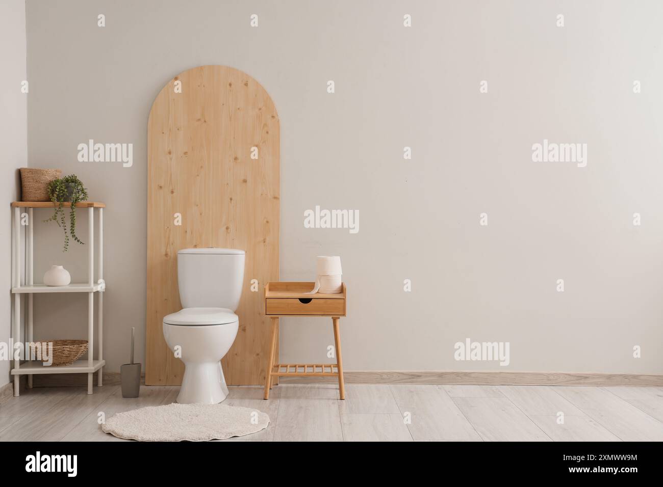 Stylish interior of modern restroom with toilet bowl, shelving unit and ...