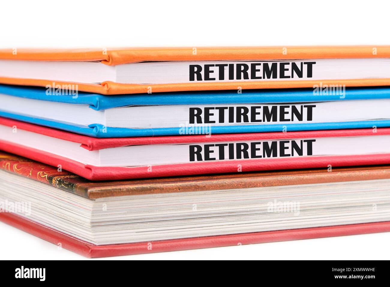 RETIREMENT text written on the ends of notebooks lying on top of each ...