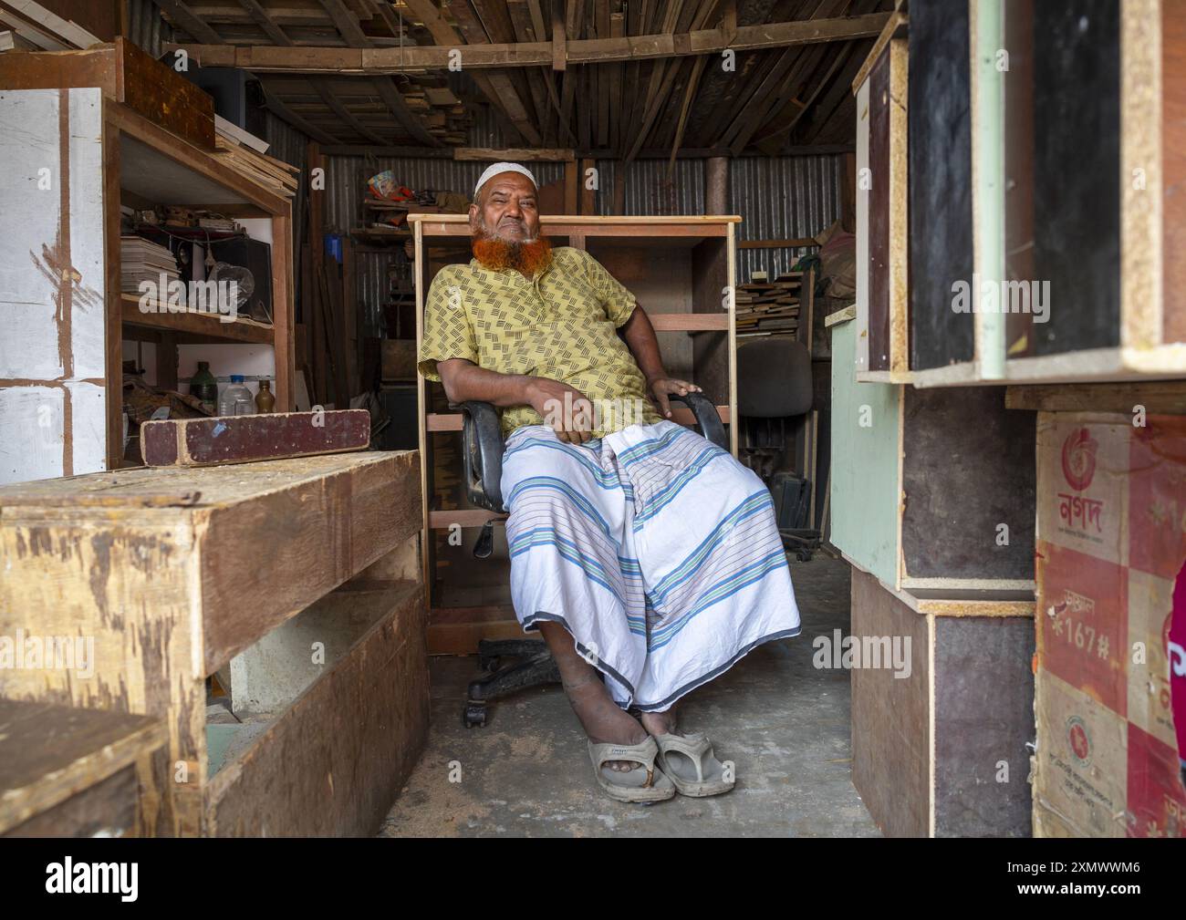Bangladeshi carpenter sit in his shop, Dhaka Division, Dhaka ...