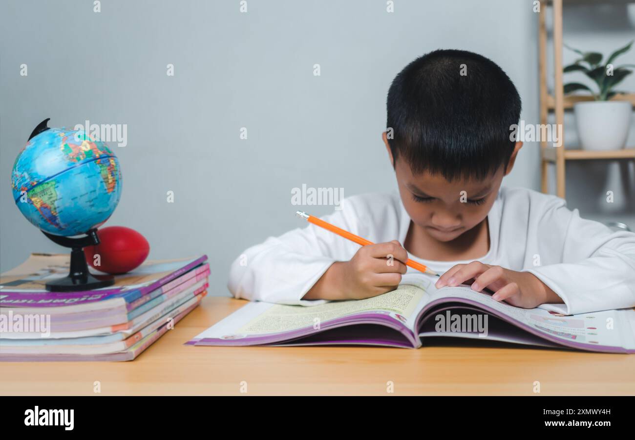 Education concept, Sad tired frustrated boy sitting at the table with ...