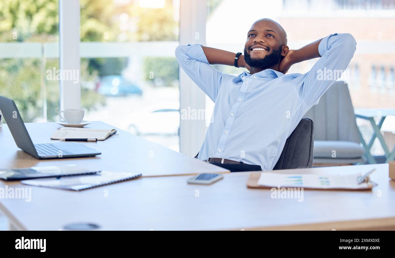 Stretching, relax and happy black man in office after finishing work ...