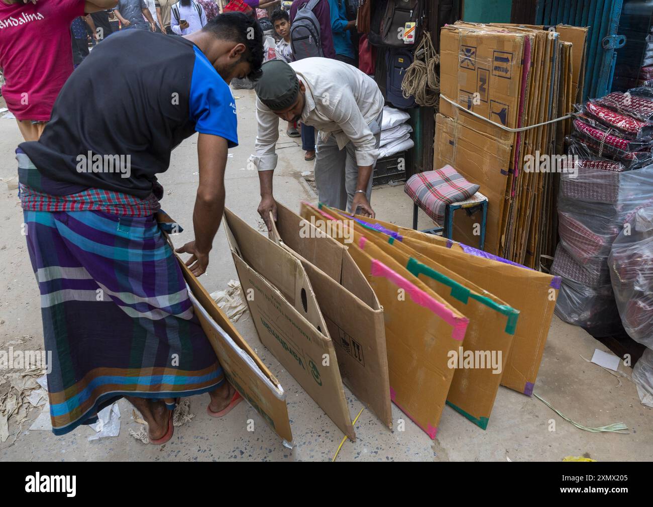 Bangladeshi men collecting cardboard boxes to recycle, Dhaka Division ...