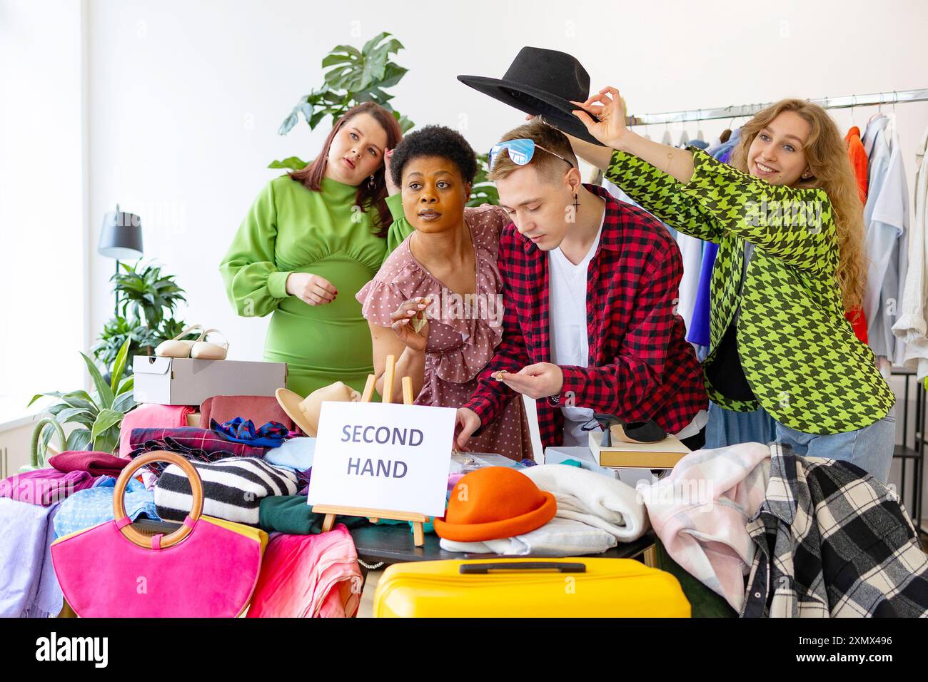 second hand store, saving money and family budget, young people ...