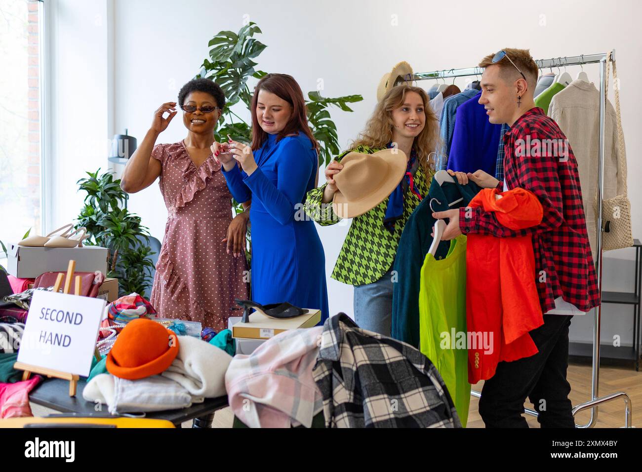 second-hand store, saving money and family budget, young people ...