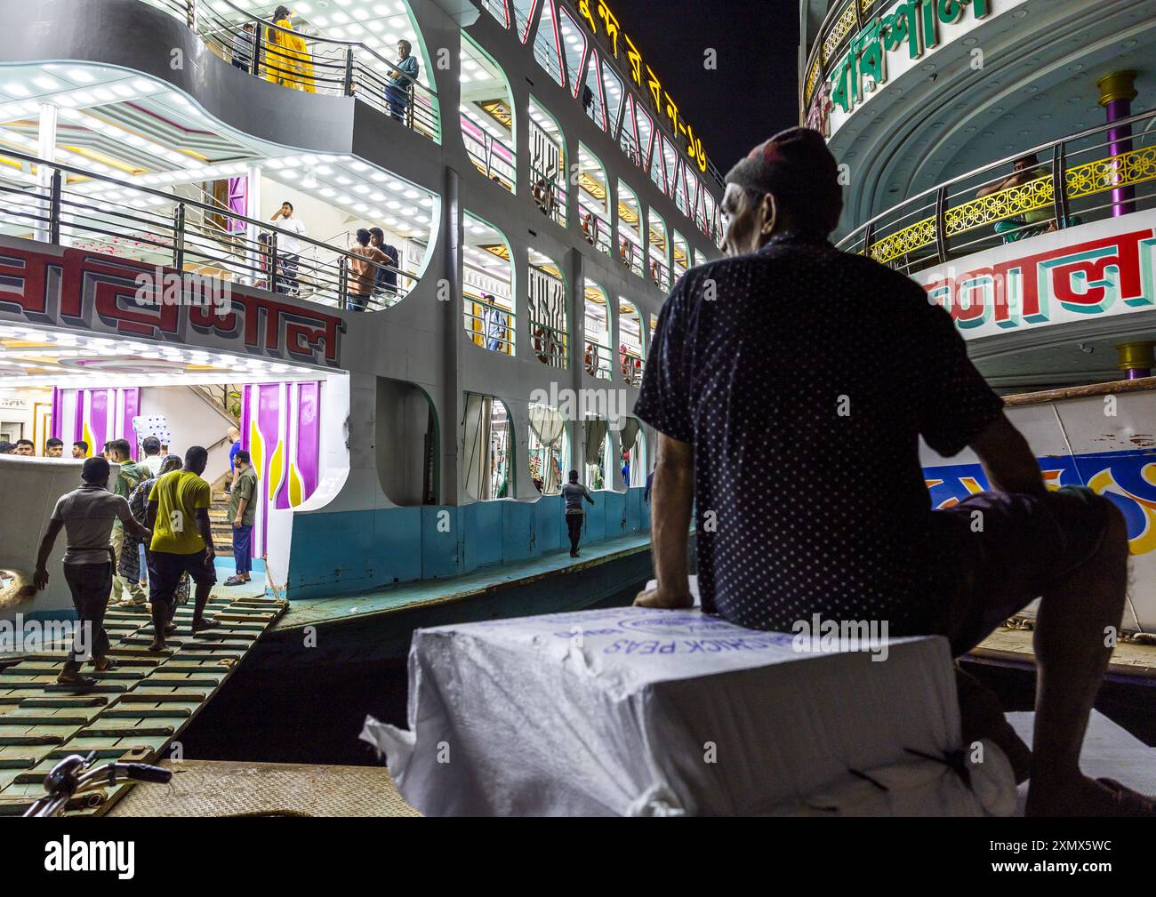 Passengers entering the ferry to Barisal at Sadaghat Launch Terminal ...