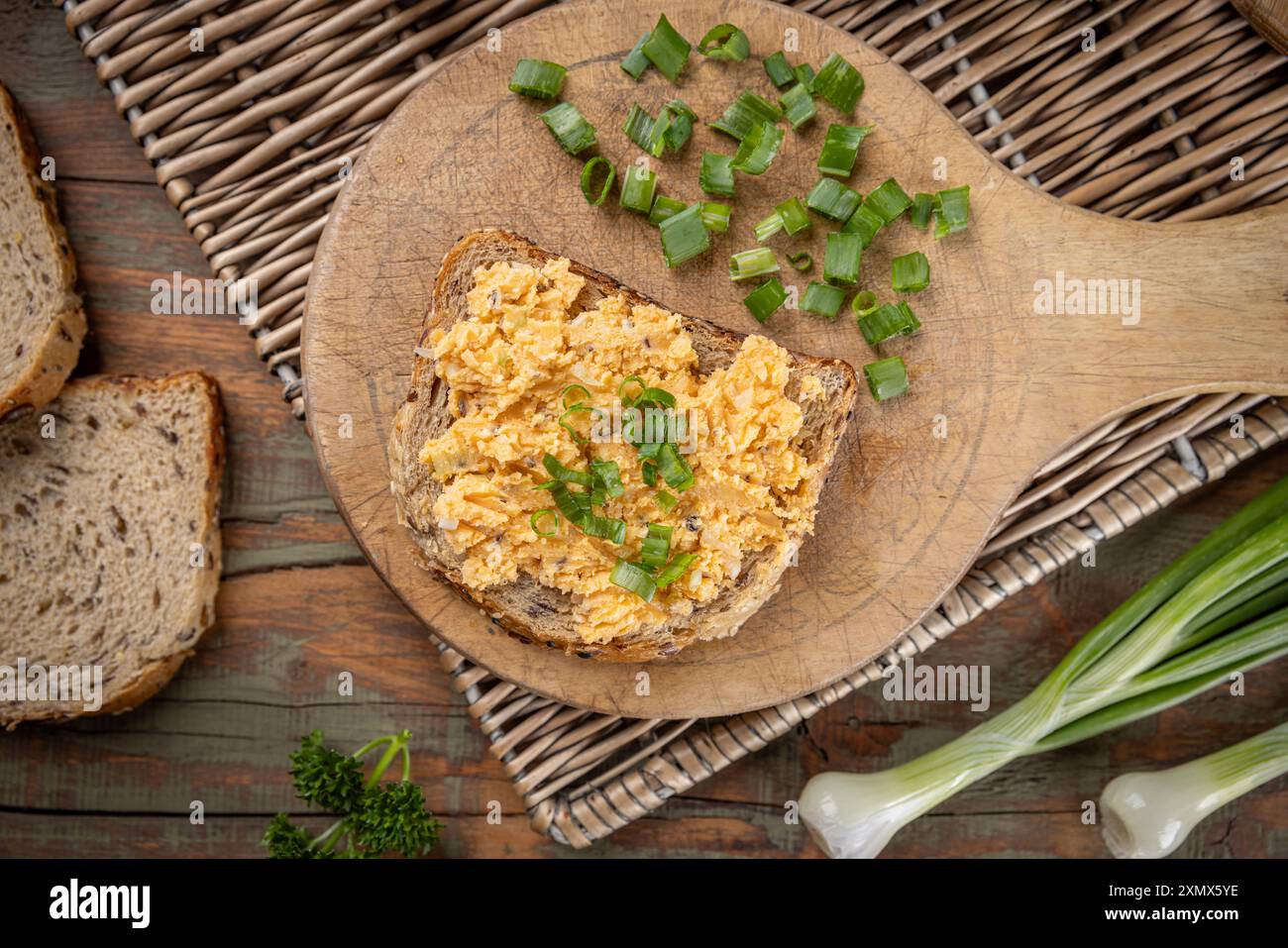 Fresh homemade egg salad spread with chives on toasted bread for ...