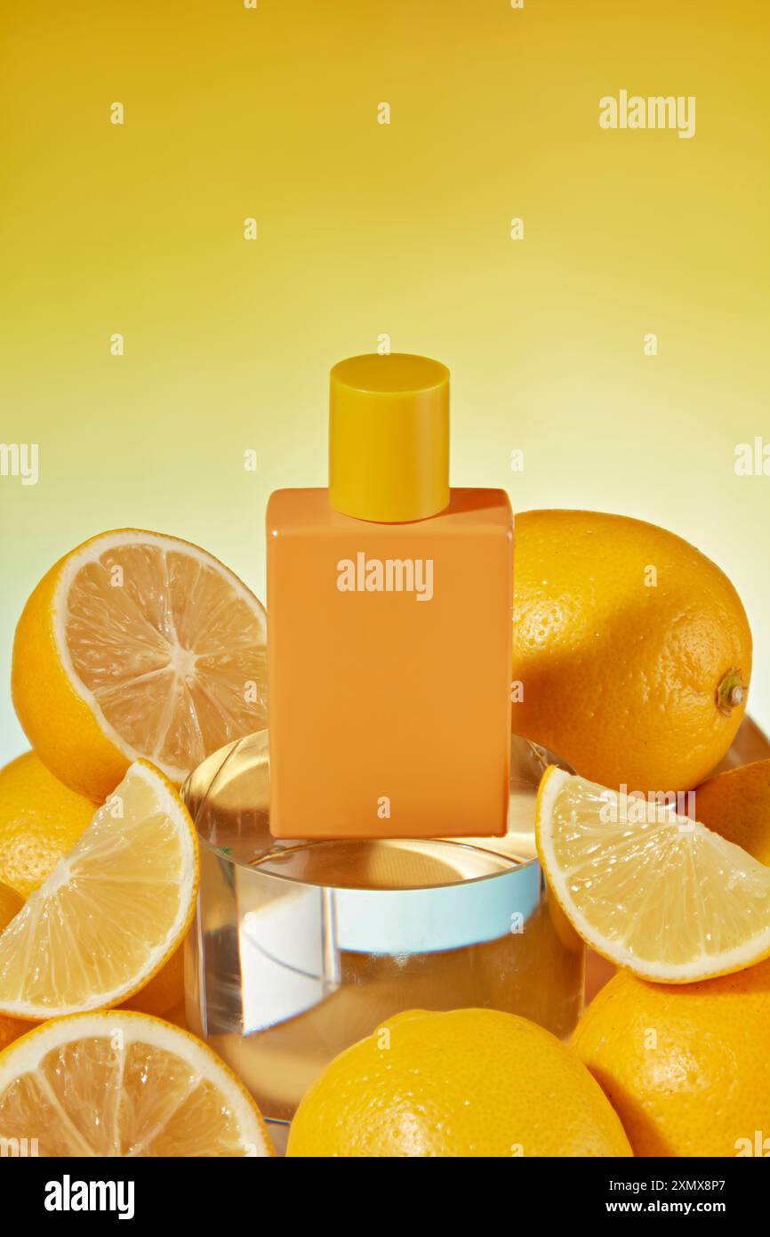 A blank label yellow bottle displayed on a glass cylindrical ...