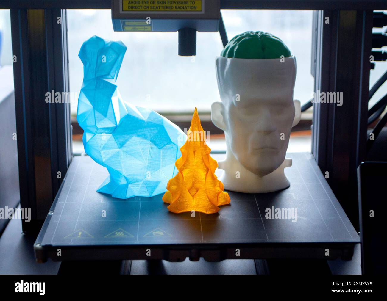 Art models printed on 3D printer on desktop of 3D printer. Models of ...