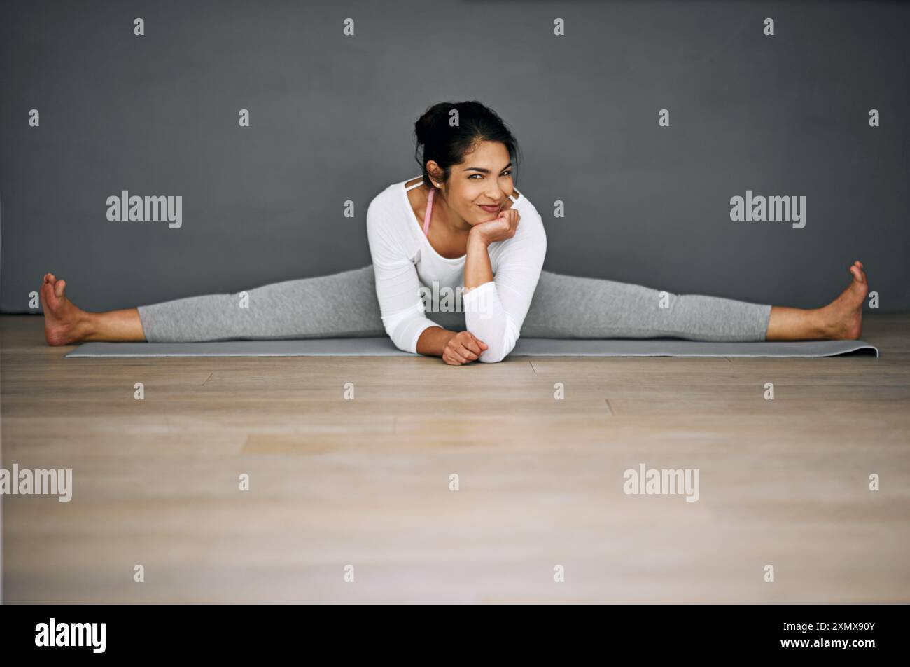 Woman, home and portrait for legs splits, pilates and wall background ...