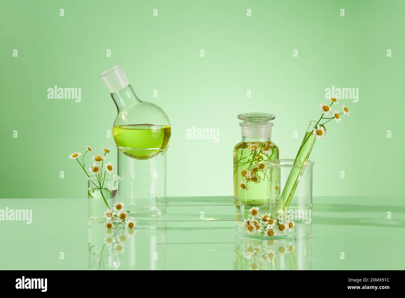Concept of laboratory, yellow fluid filled in transparent boiling flask ...