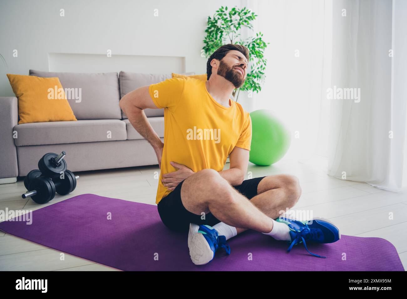 Photo of stressed guy suffer strong pain hurt injury symptom need salve ...