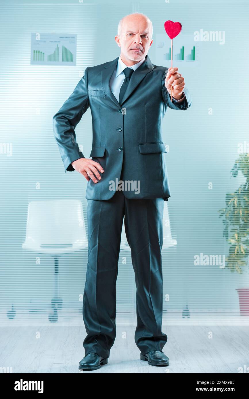 Boomer man in a suit holding a heart on a stick, with a stern ...