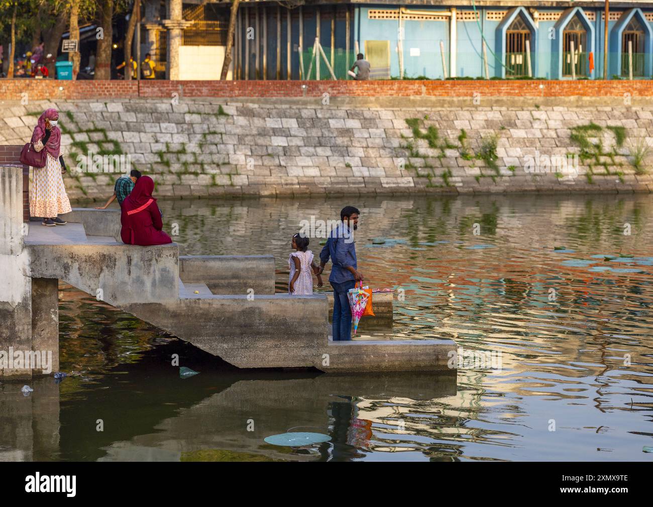Bangladeshi people on the stairs of a pond, Khulna Division, Jessore ...