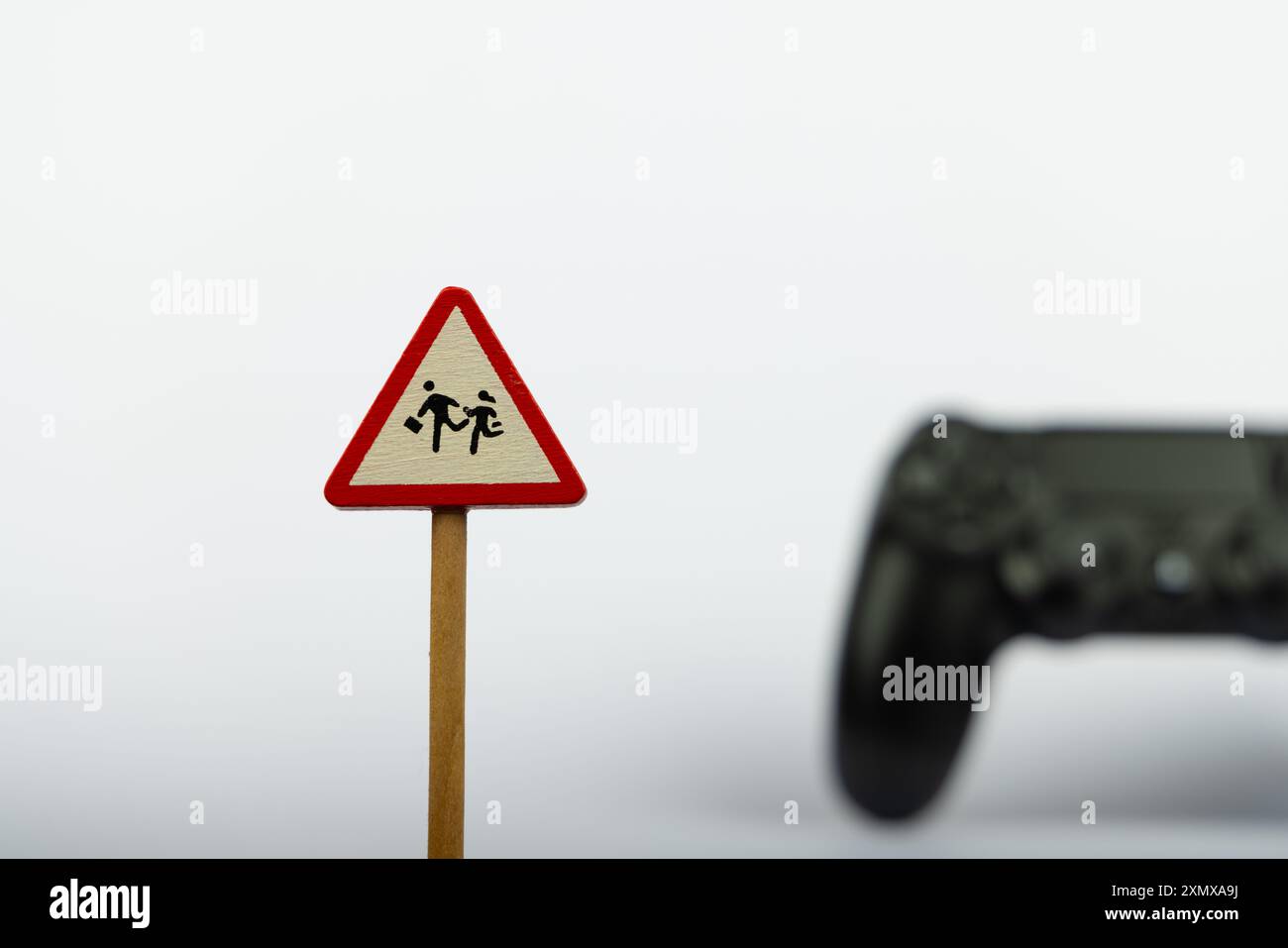 A wooden "WARNINGS CHILDS" sign is displayed alongside a video game ...