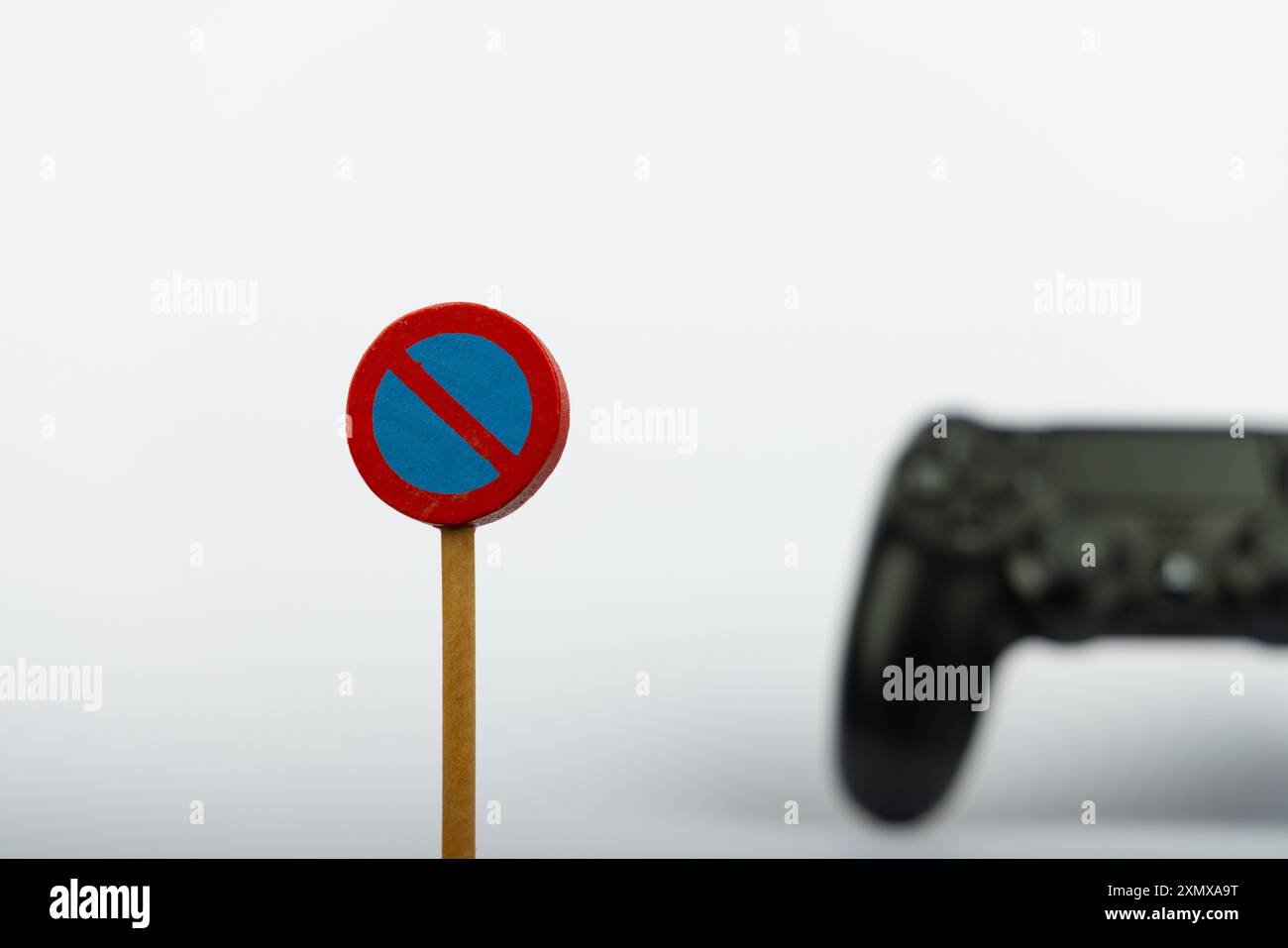 A wooden toy No Parking sign is featured clearly in the image, while a ...