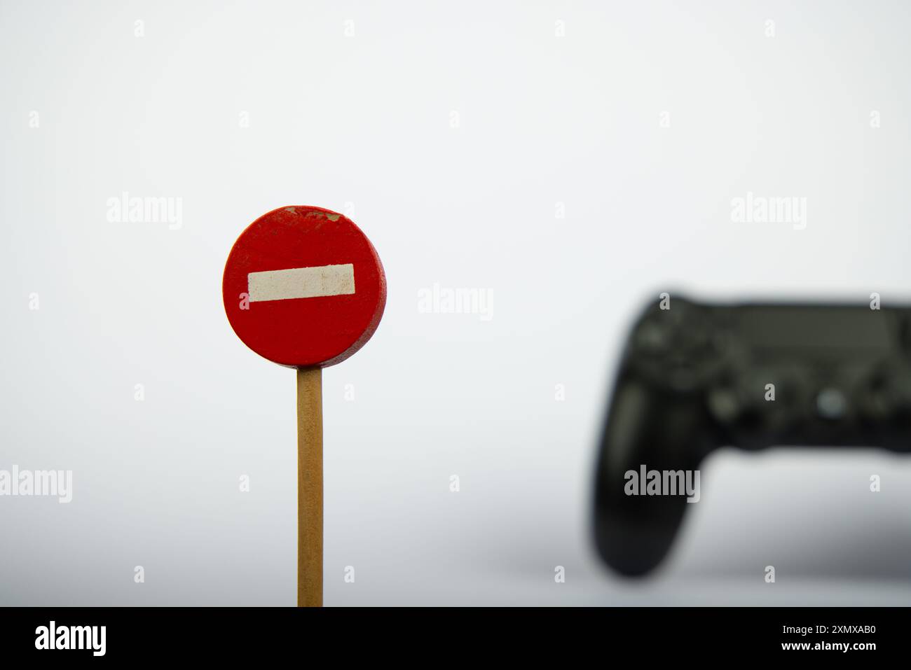 A wooden toy "No Entry" sign is prominently displayed with a blurred ...