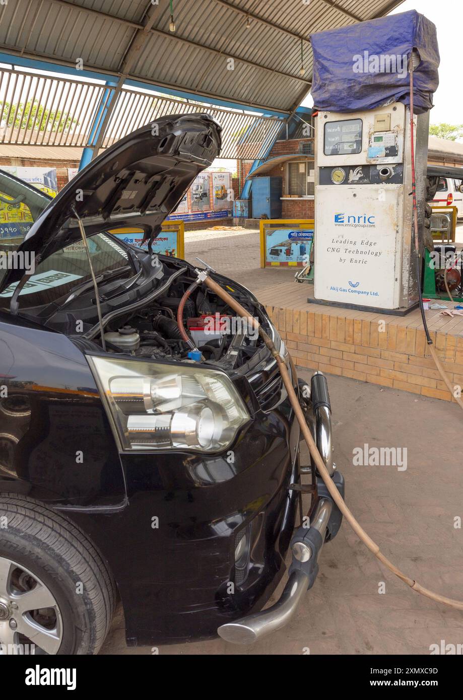 Car charging compressed natural gas in a station, Khulna Division ...