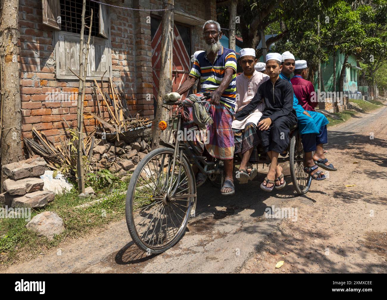 Bangladeshi muslim boys on a rickshaw, Rajshahi Division, Puthia ...