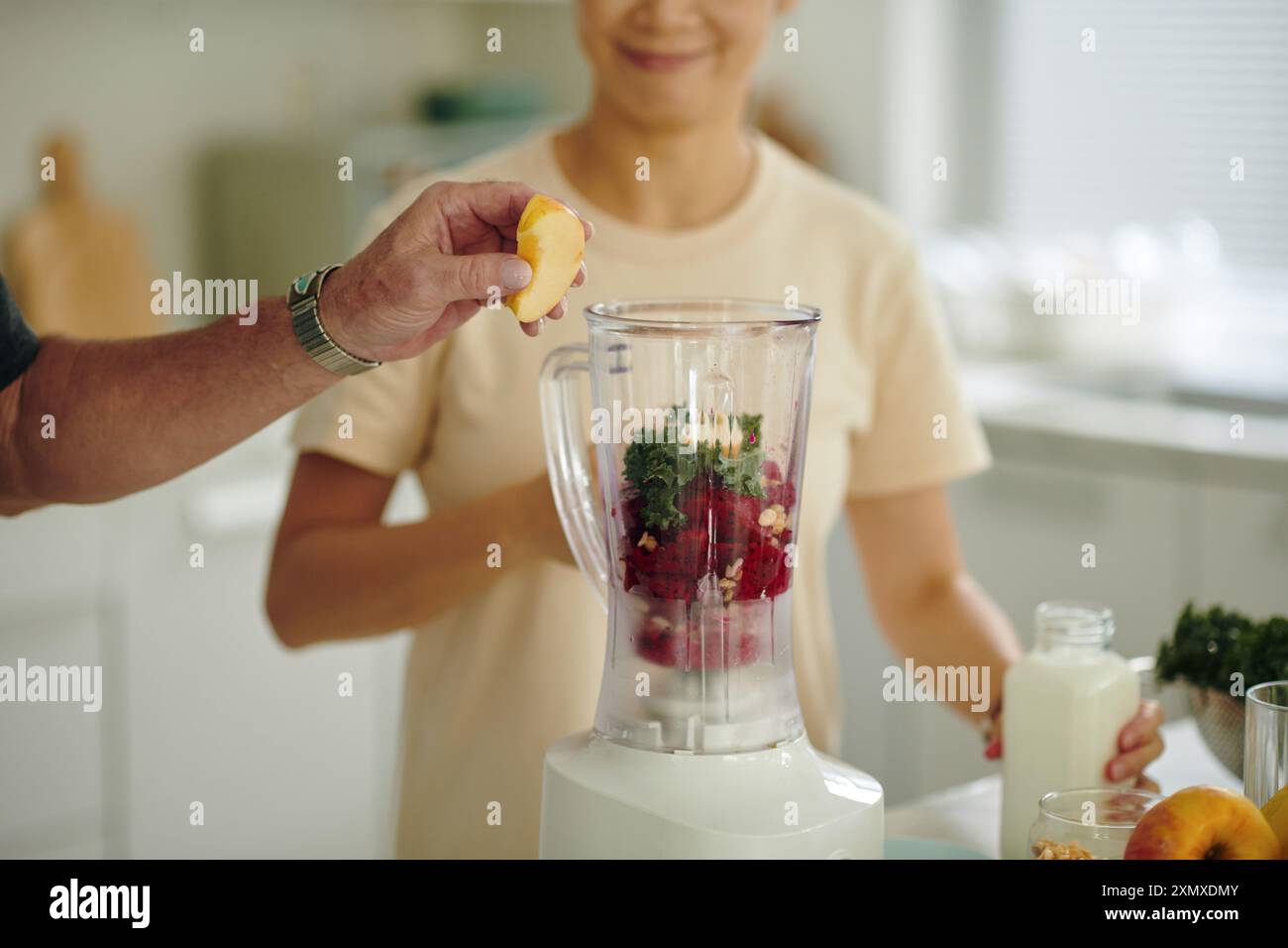 Woman blending fruits in blender hi-res stock photography and images ...