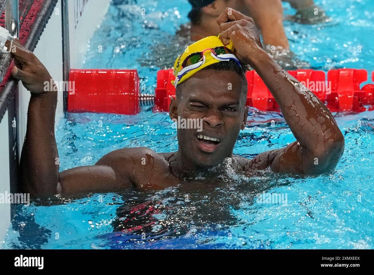 Josh Tarere, of Papua New Guinea, competes during a heat in the men's ...