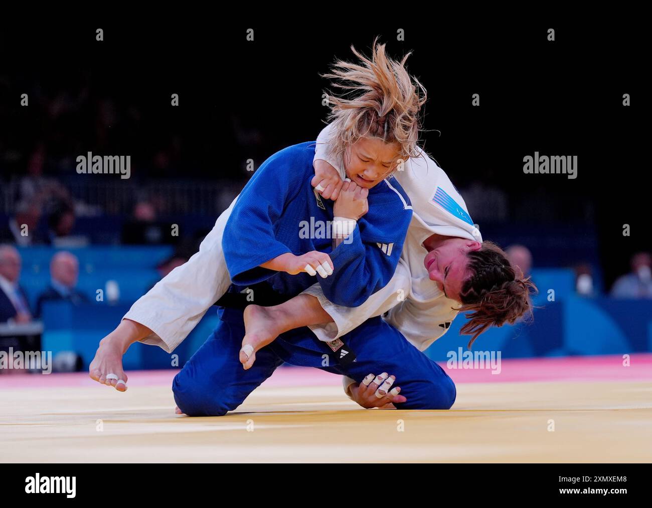 Korea's Jisu Kim (blue) and Portugal's Barbara Timo (white) during the ...