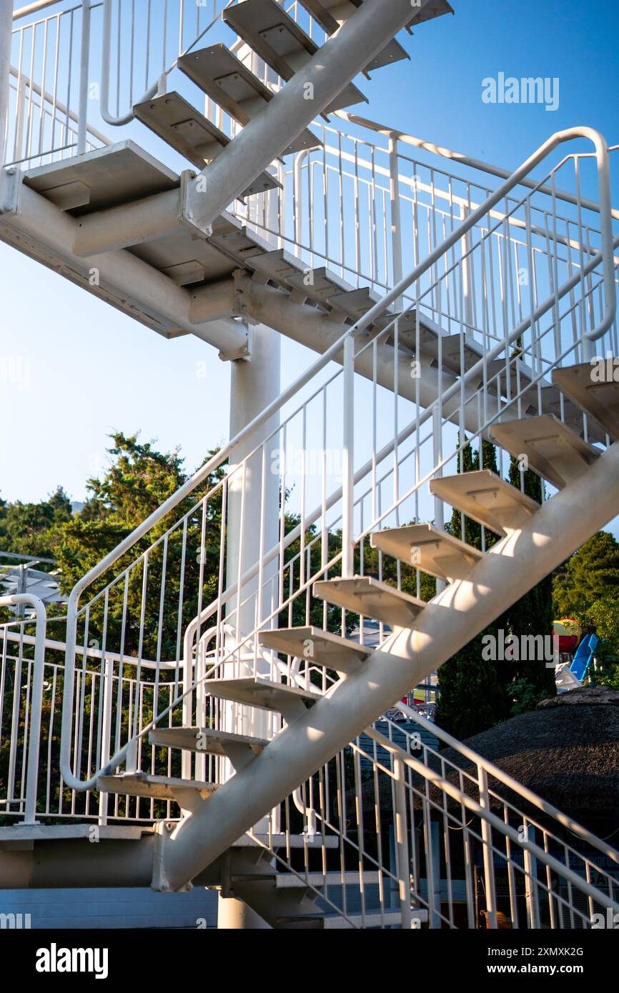 Stairs, White, Metal - A low angle shot of white metal stairs with ...