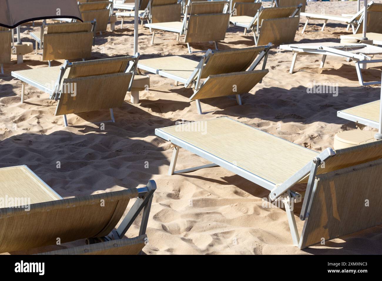 Empty Sun Loungers on Sandy Beach Stock Photo - Alamy