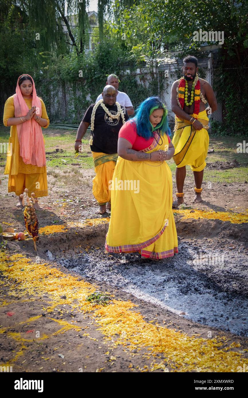 Devout Hindu worshipper walks barefoot on hot burning coals at the ...