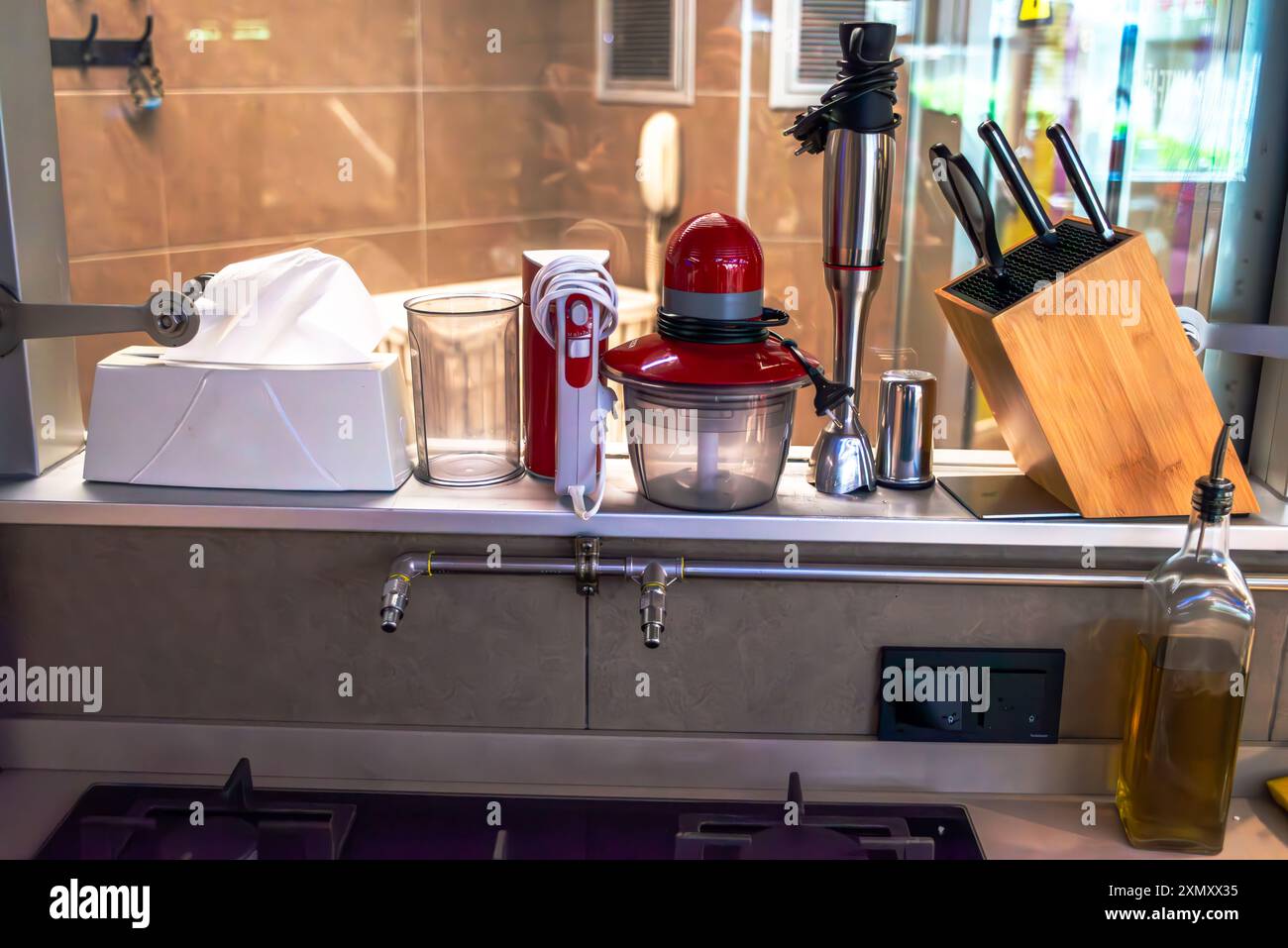 A collection of various kitchen items, including knives, a kitchen ...