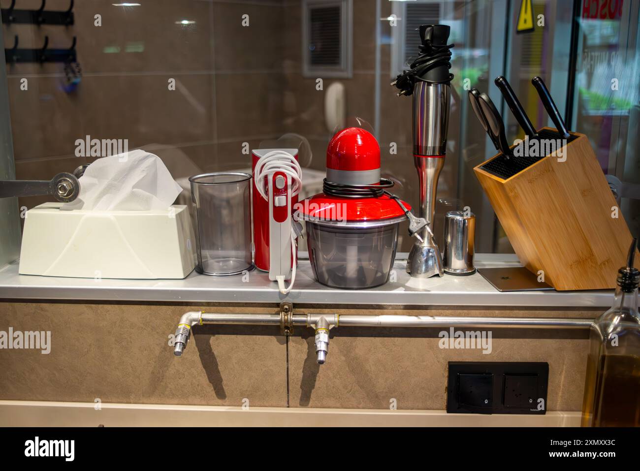 A collection of various kitchen items, including knives, a kitchen ...