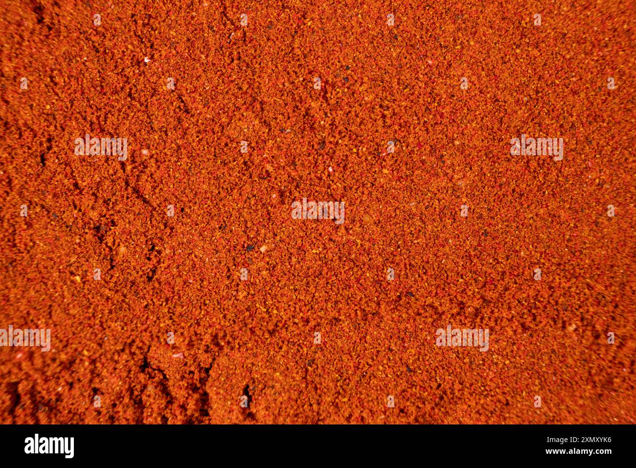 Abstract red background made of smoked paprika. Spice texture, art in ...