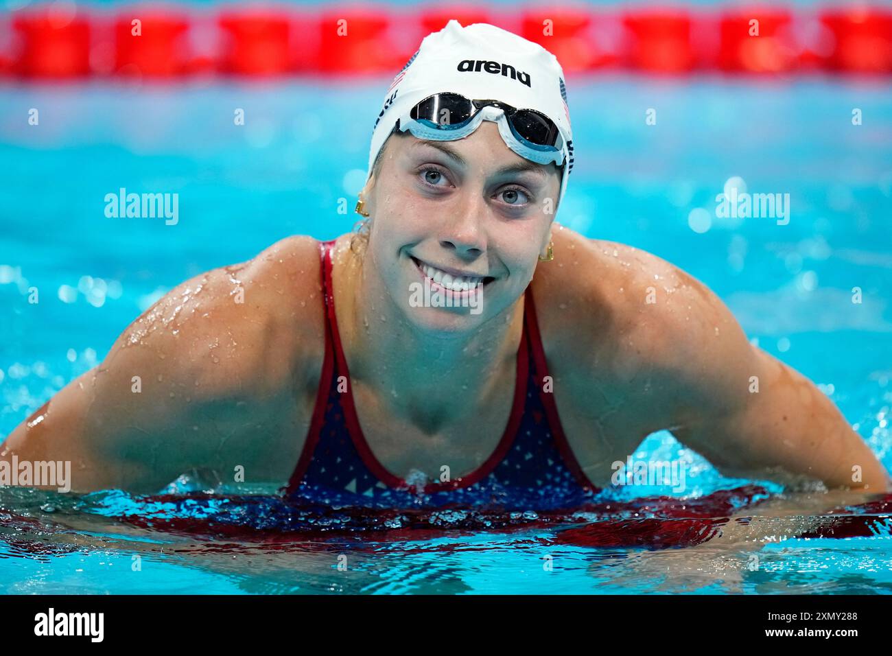 Gretchen Walsh, of the United States, reacts following her heat in the ...