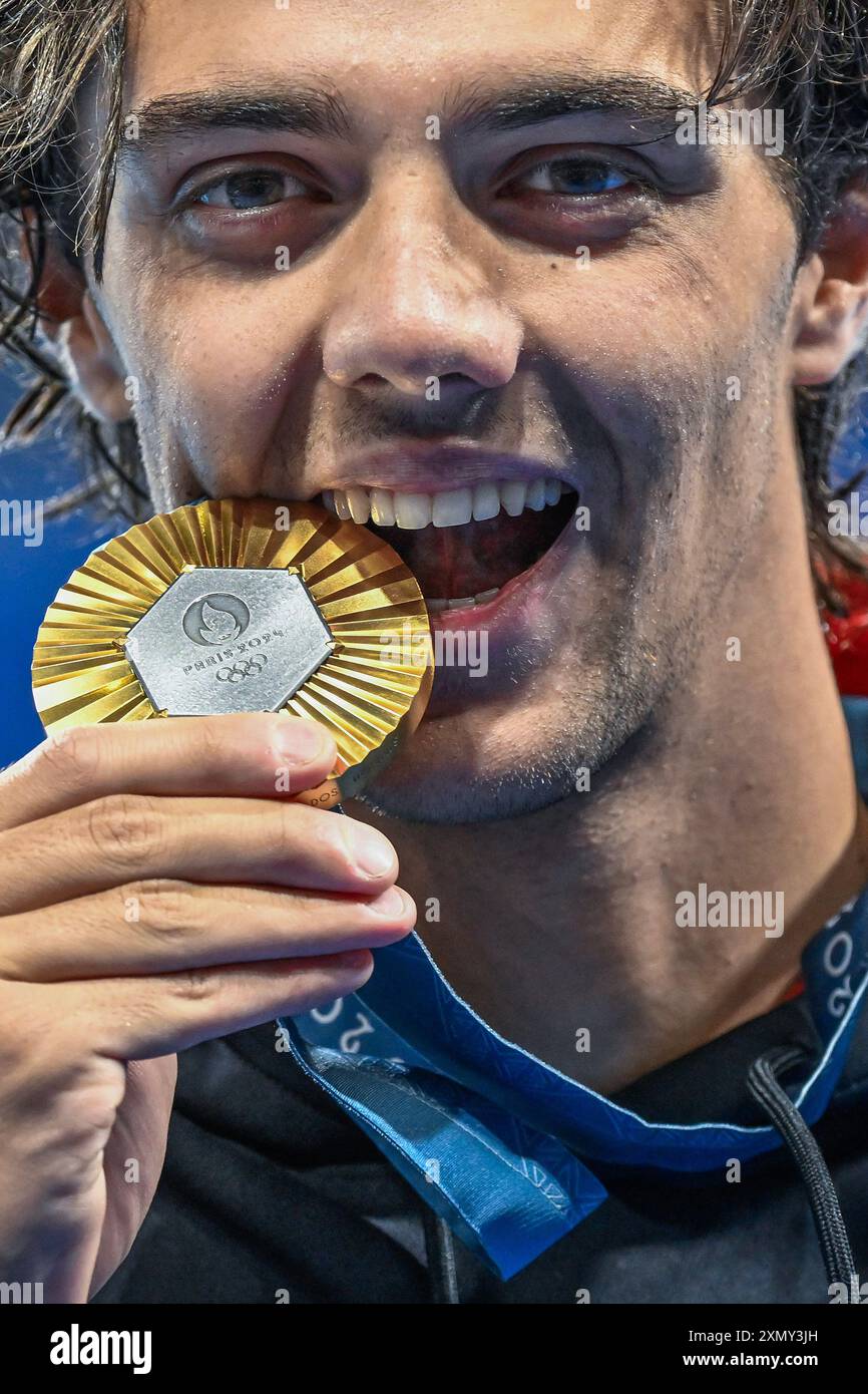 Paris, France. 29th July, 2024. Thomas Ceccon of Italy shows the gold ...