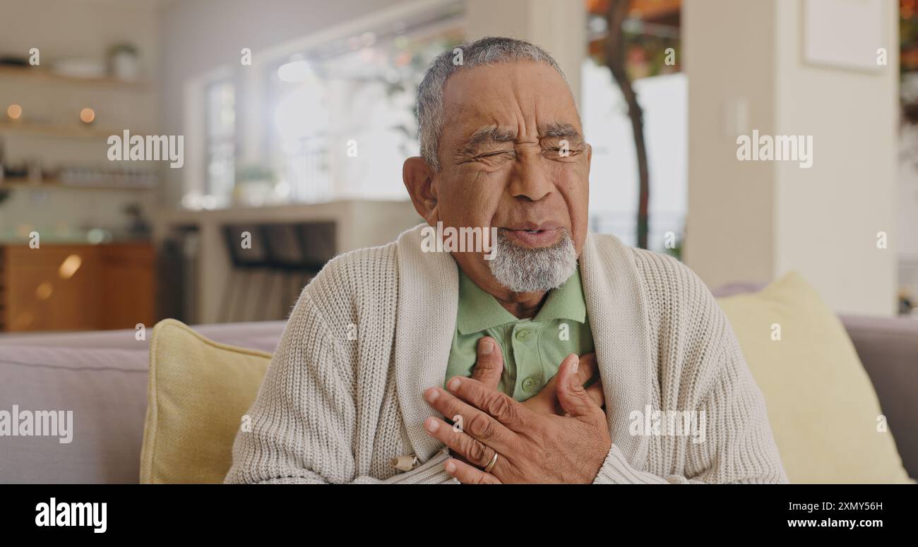 Home, senior man and chest pain on sofa, coughing and pneumonia ...