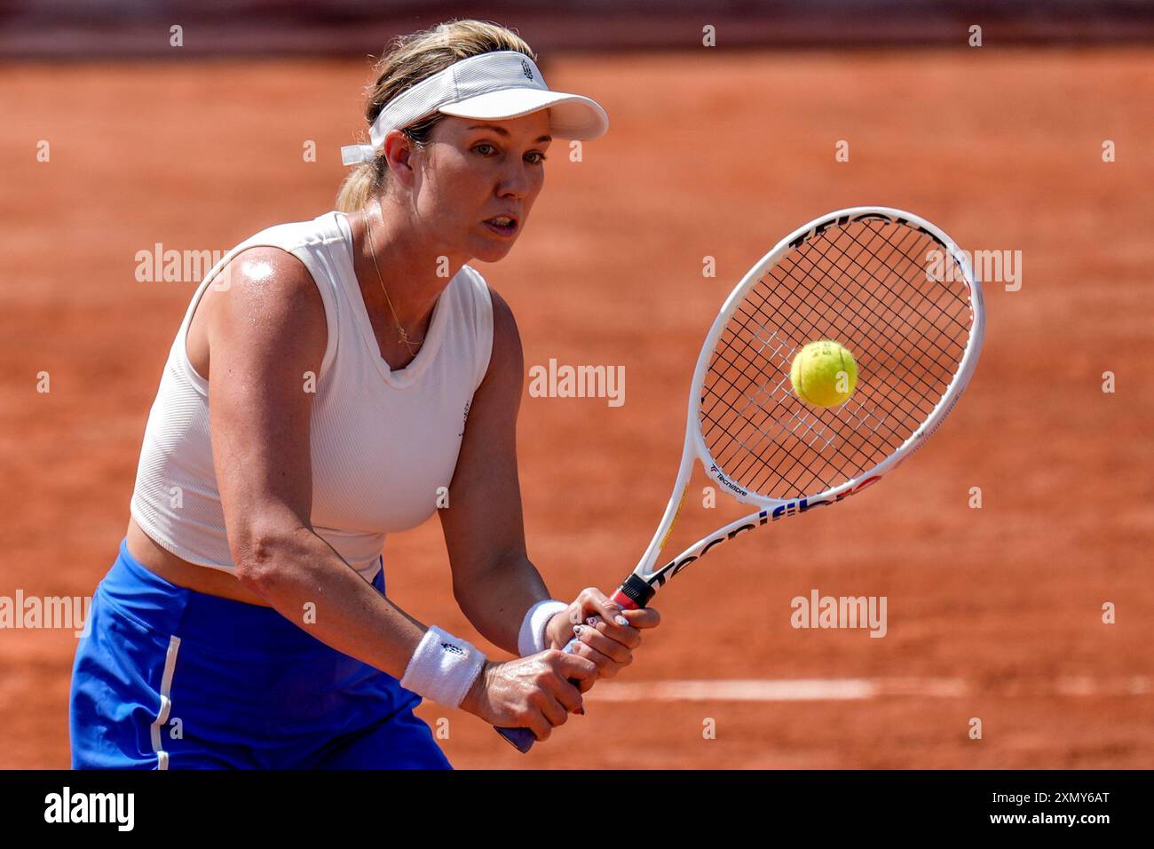 Danielle Collins of the United States returns the ball against Camila ...