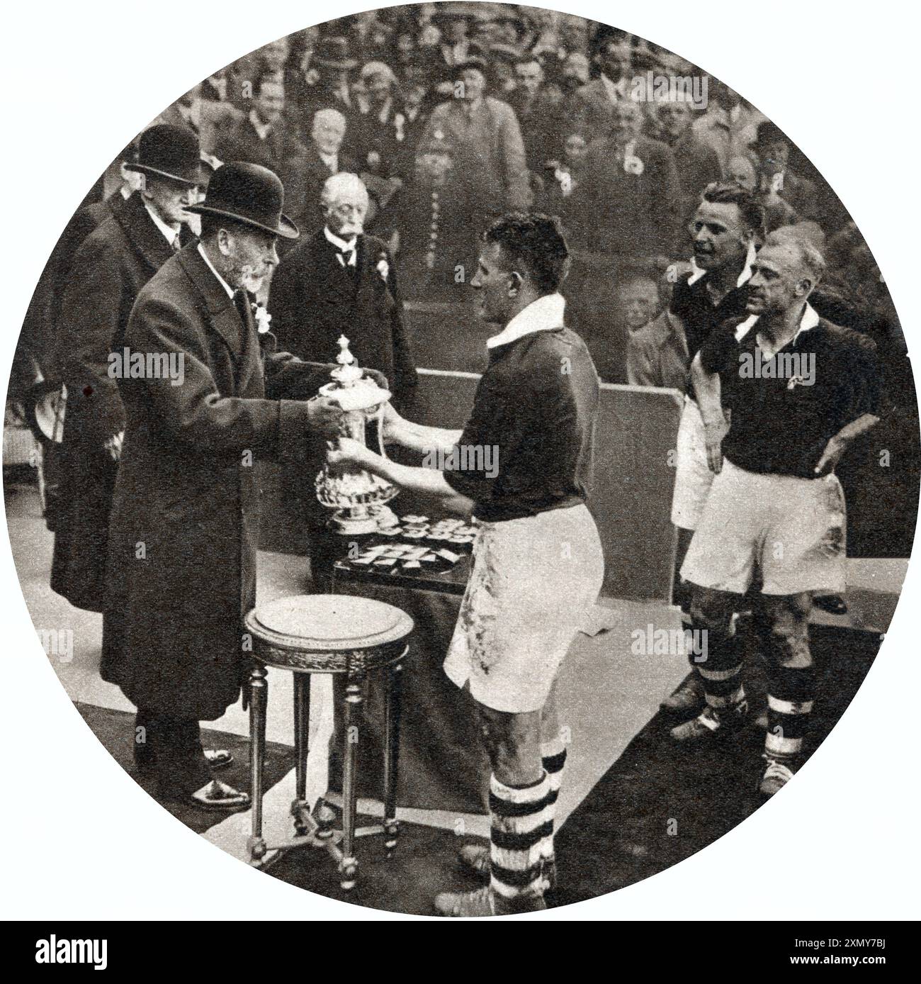 King George V presenting the A Cup to Cowan of Man City Stock Photo - Alamy