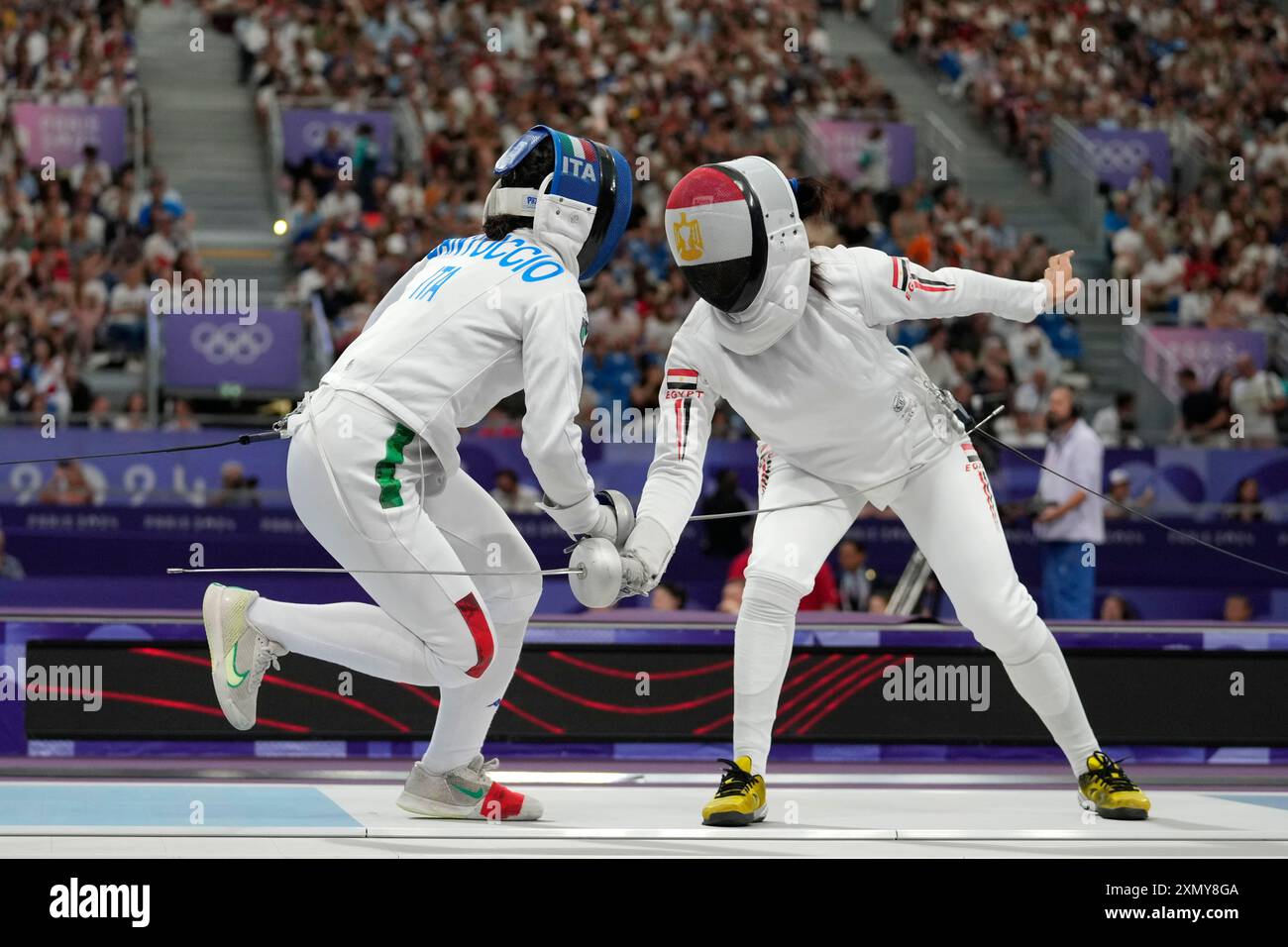 Italy's Alberta Santuccio, left, competes with Egypt's Shirwit Gaber in ...