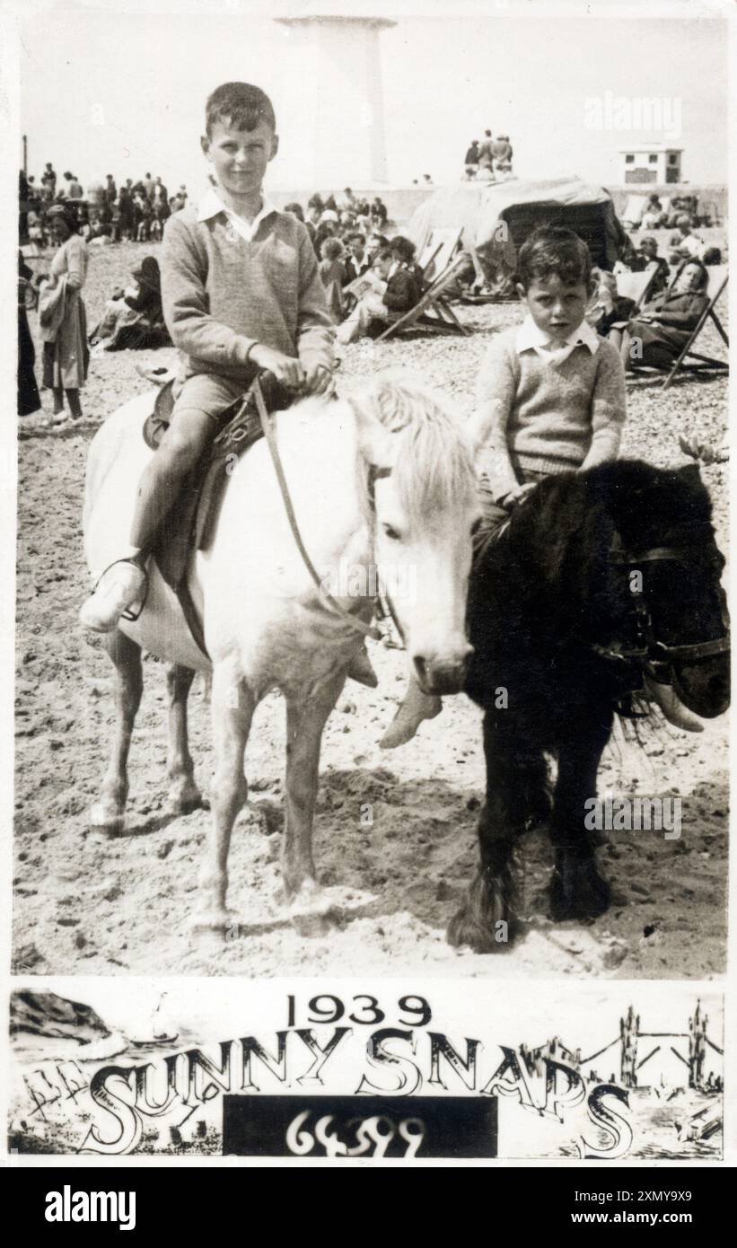 Riding ponies on the beach - English Summer Holiday Stock Photo - Alamy