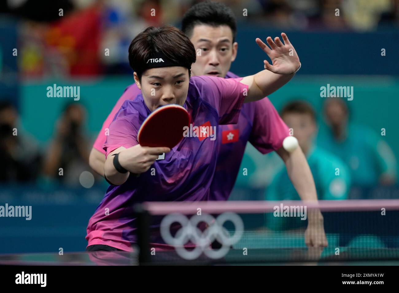 Hong Kong's Doo Hoi Kem, with her teammate Wong Chun Ting, plays ...