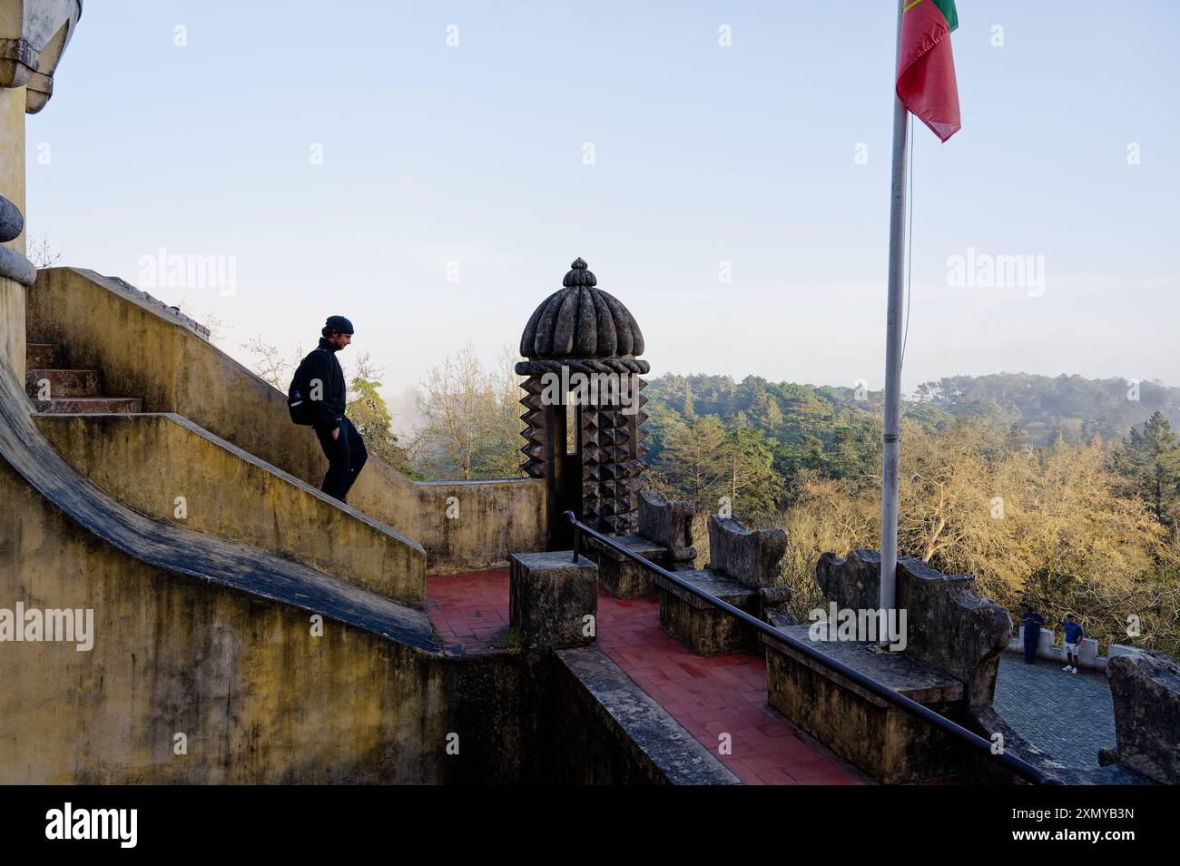 A visitor walks along the ancient walls of Pena Palace Stock Photo - Alamy