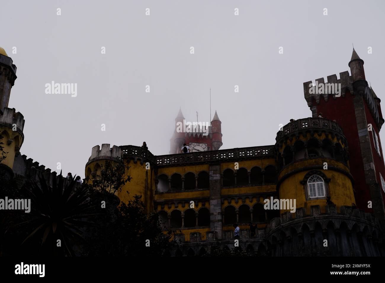 The iconic buildings the Pena Palace as the iconic red clock tower ...