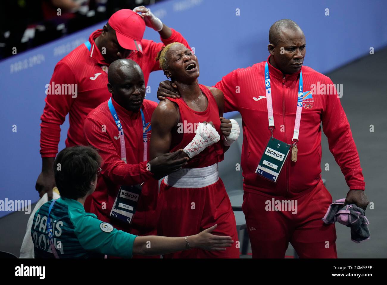 Democratic Republic of the Congo's Marcelat Sakobi, center, cries ...