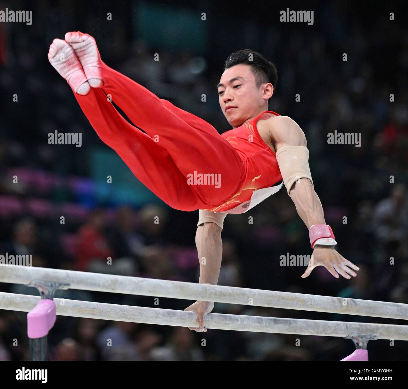 ZOU Jingyuan of china performs in the men's artistic gymnastics team ...